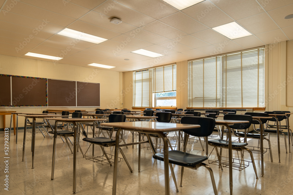 Example of an empty nondescript US High School Classroom with desks ...