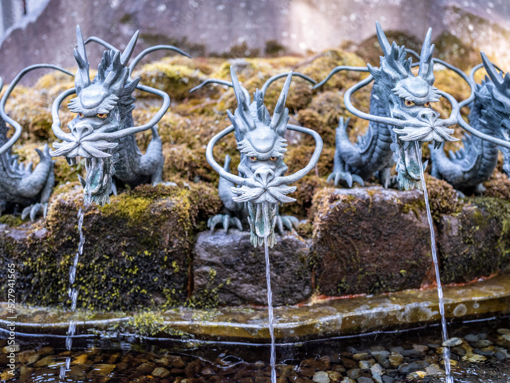 dragon fountain with multiple heads in a shinto shrine in Japan Stock ...