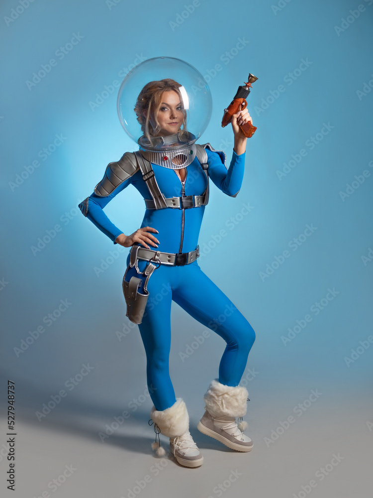 Fantastic astronaut costume in retrofuturism style. A young beautiful ...