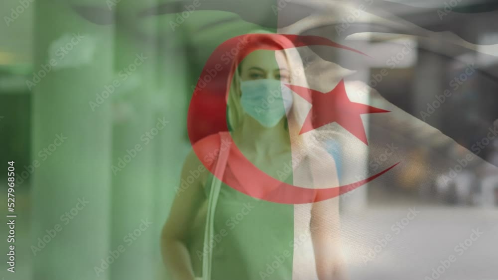 Animation of flag of algeria waving over caucasian woman wearing face ...