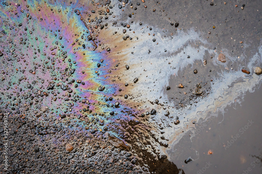 Oil slick on the asphalt road background Stock Photo | Adobe Stock