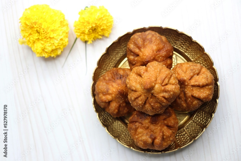 Fried Modak. It's a traditional sweet dish of coconut, jaggery, and dry ...