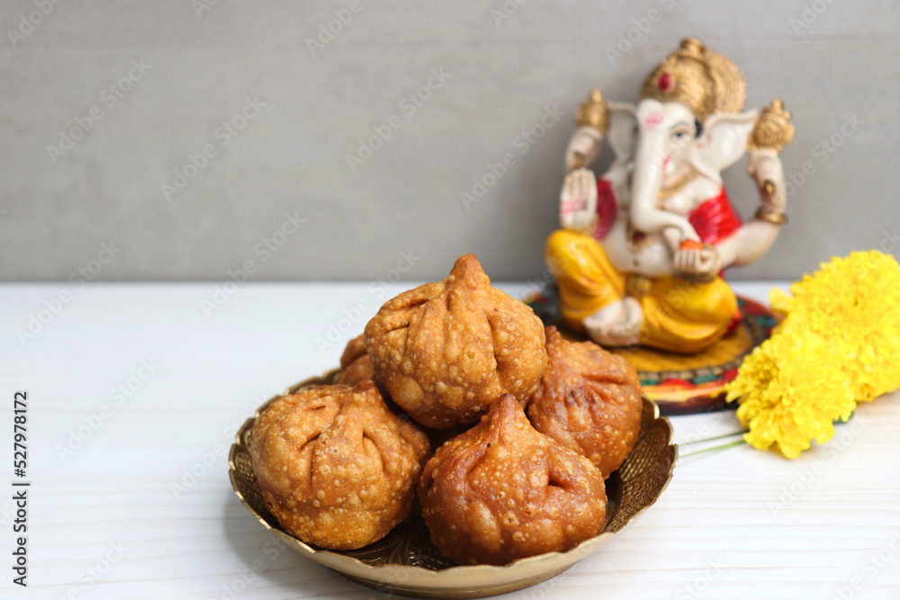 Fried Modak. It's a traditional sweet dish of coconut, jaggery, and dry ...