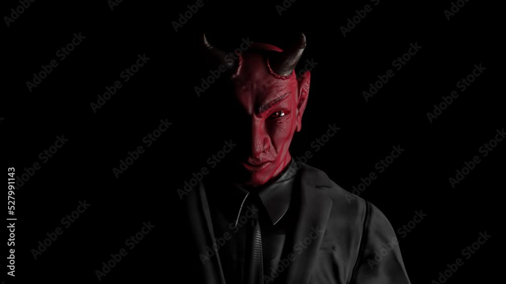 Appearance of red devil from the darkness. light from the side. Horror ...