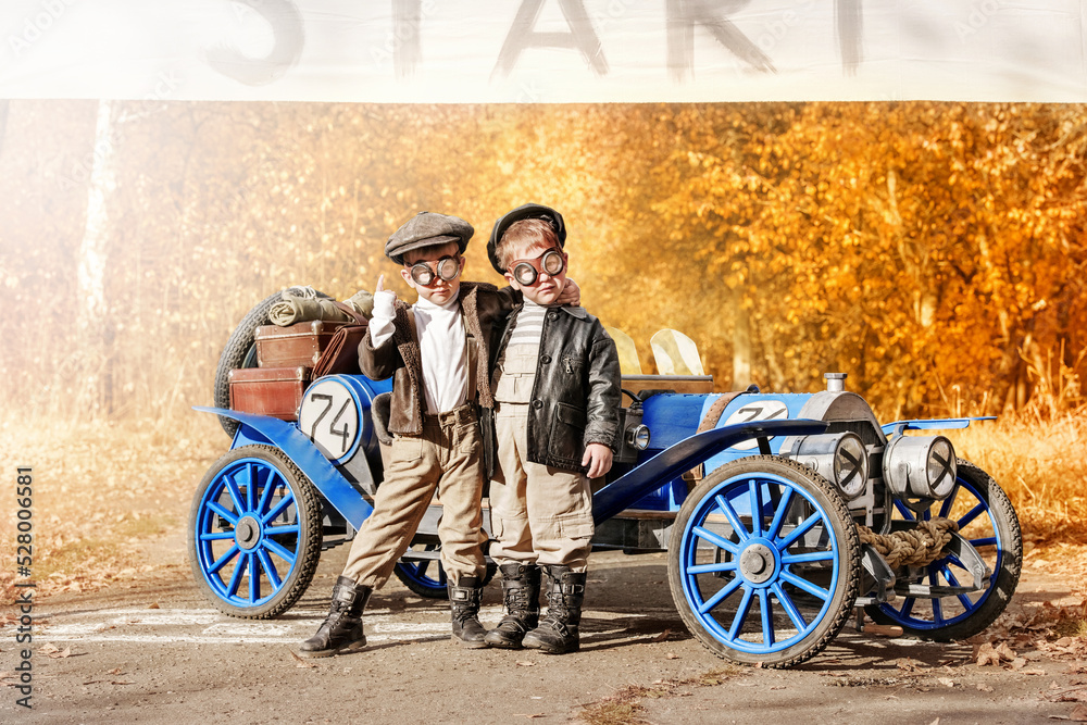 Young happy children. Little funny boys in the form of racers began to ...