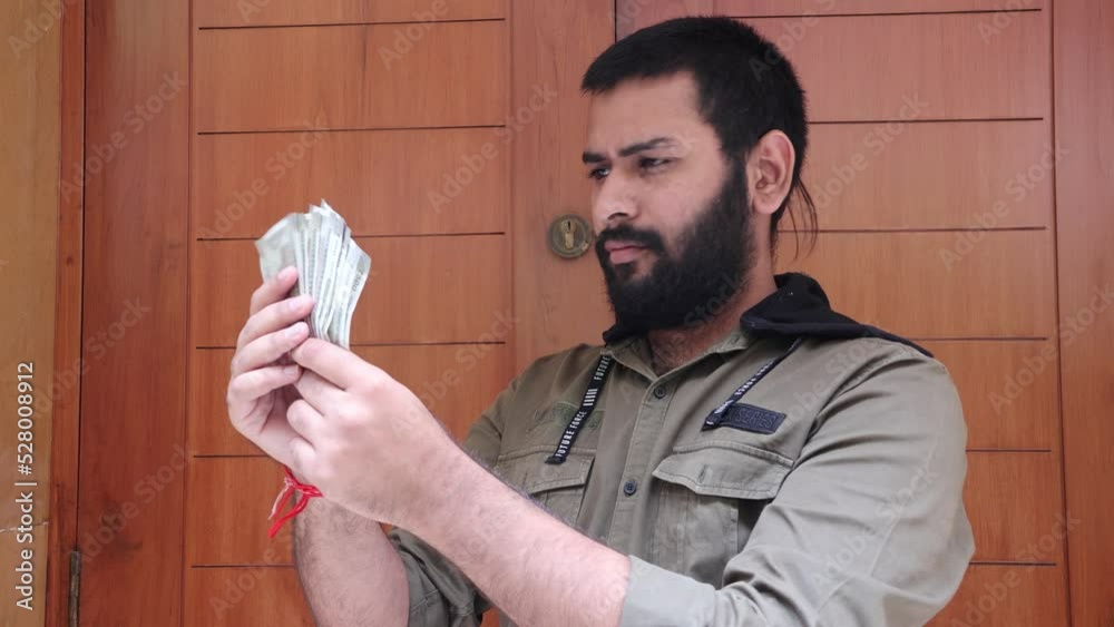 Angry man finding Fake Indian rupees. Concept shot of receiving fake ...