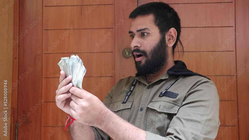 Angry man finding Fake Indian rupees. Concept shot of receiving fake ...