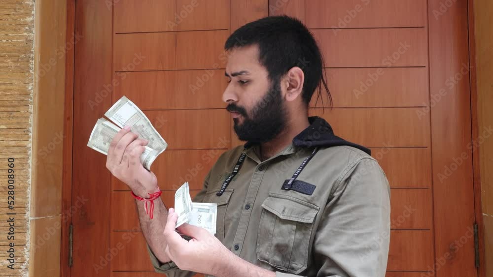 Angry man finding Fake Indian rupees. Concept shot of receiving fake ...