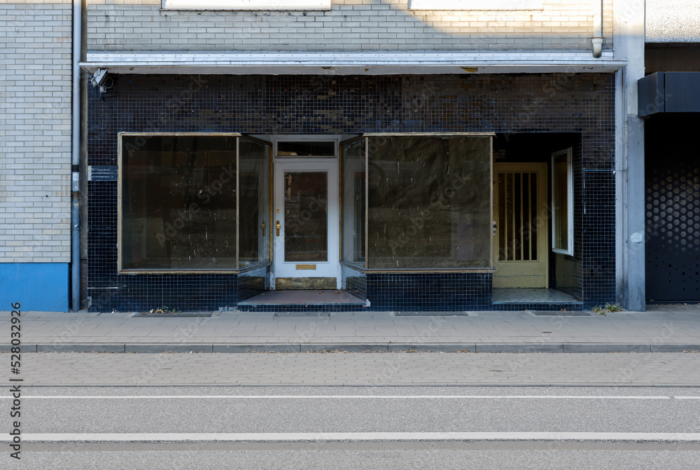 abandoned shop in the urban city near sidewalk, empty store with glass ...