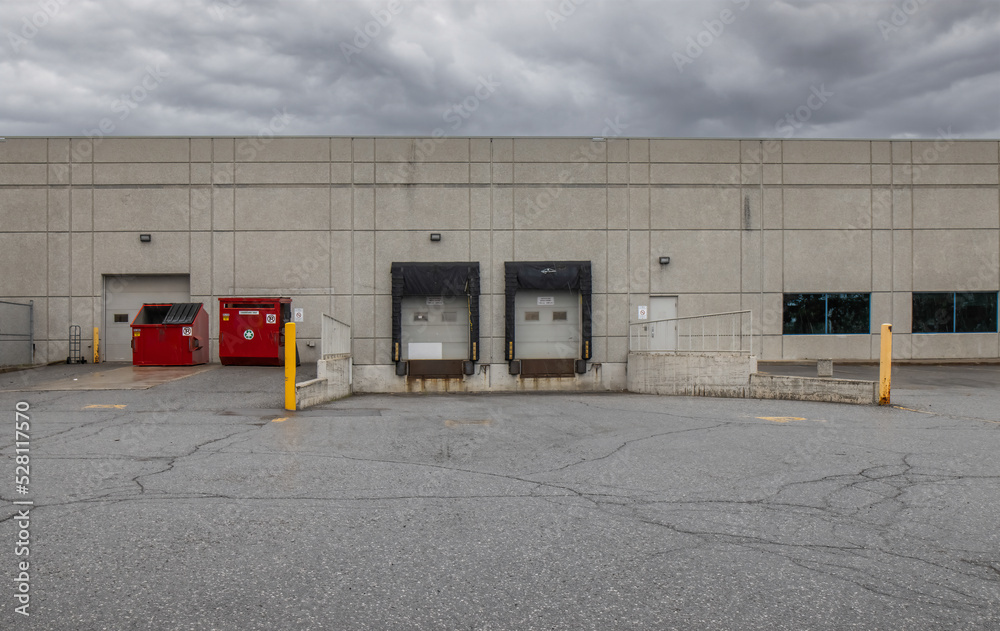Facade of low-rise commercial building exterior, prefab stucco panels ...