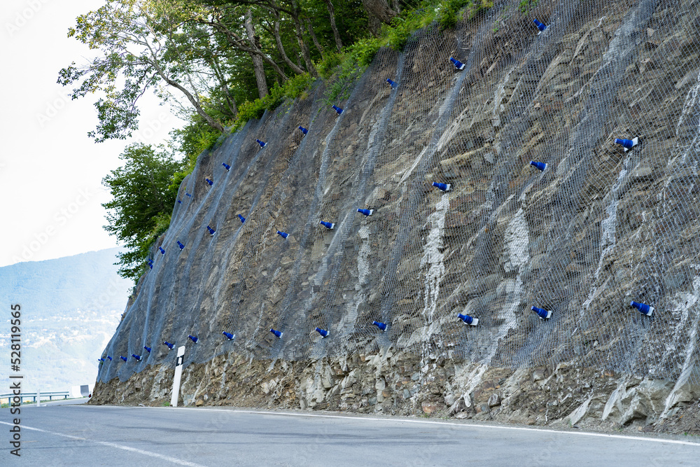 Reinforcing mountain slope with metal mesh and concrete reinforcement ...