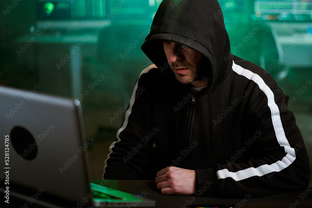 Computer hacker typing code on keyboard late night working and bypassing cyber security. Stock ...