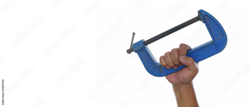Hand holding blue c clamp isolated white background with copy space ...