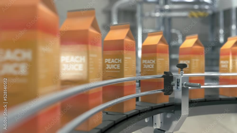 Automated conveyor sorting the packages of the peach juice. Automated ...