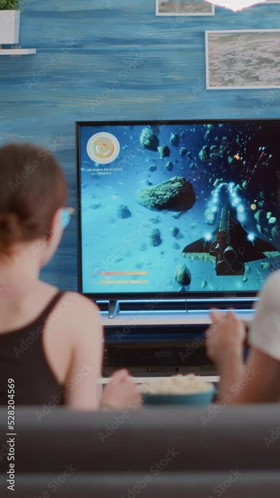 Gamer couple doing high five hand gesture celebrating victory in online ...