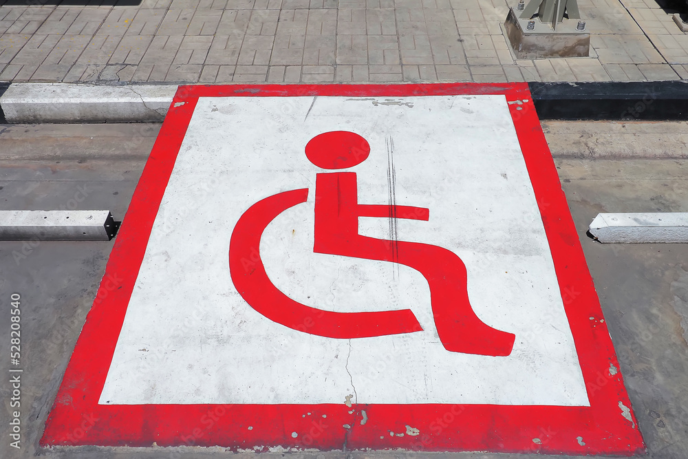 Wheelchair symbol in a disabled parking lot old icons red color and ...