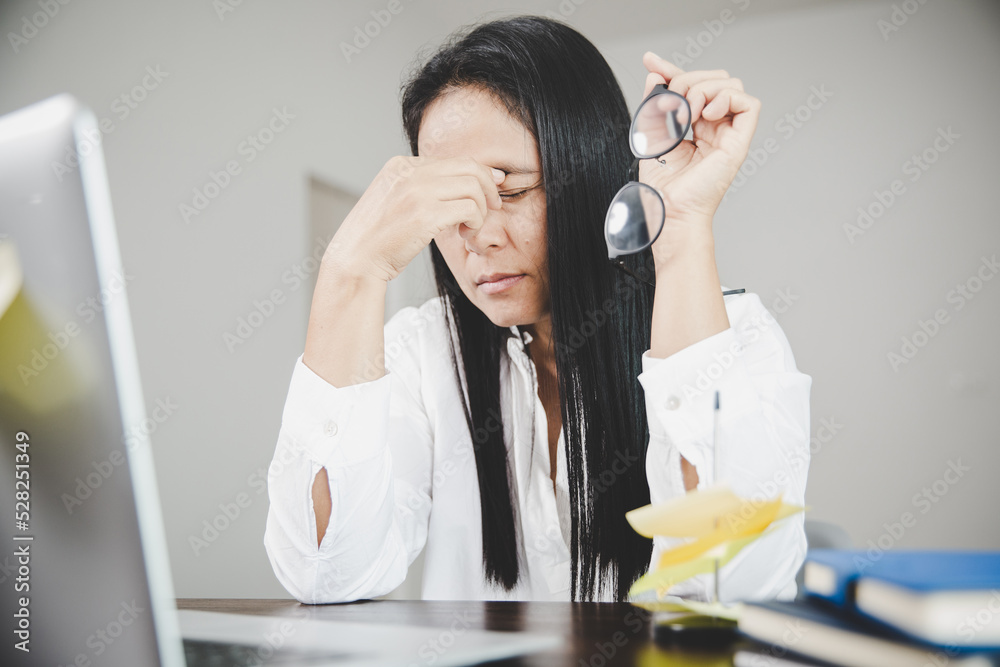 Young business woman person sleepy and has frustration eye problems ...
