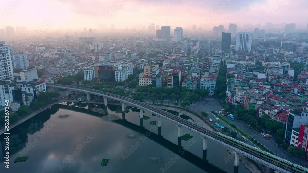 Drone view, aerial view of Vietnam Hanoi city in the morning with the train Metropolis running ...