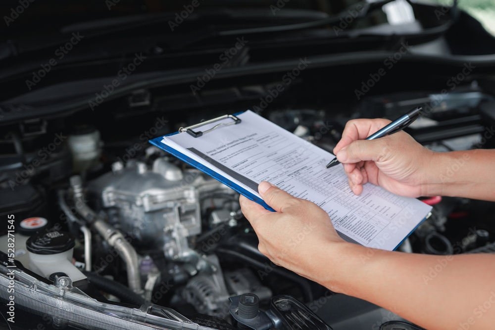 Car service concept, Close up hand car service staff check engine ...