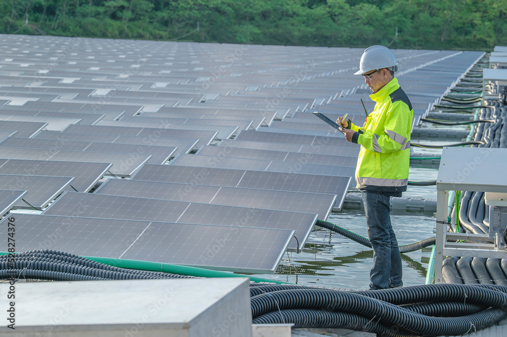 Asian engineer working at Floating solar power plant,Renewable energy ...