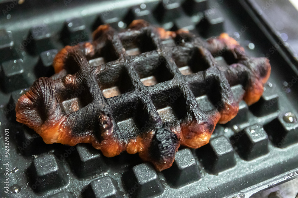 Burnt Croffle; Croissant+Waffle on cast iron waffle iron on a stovetop ...