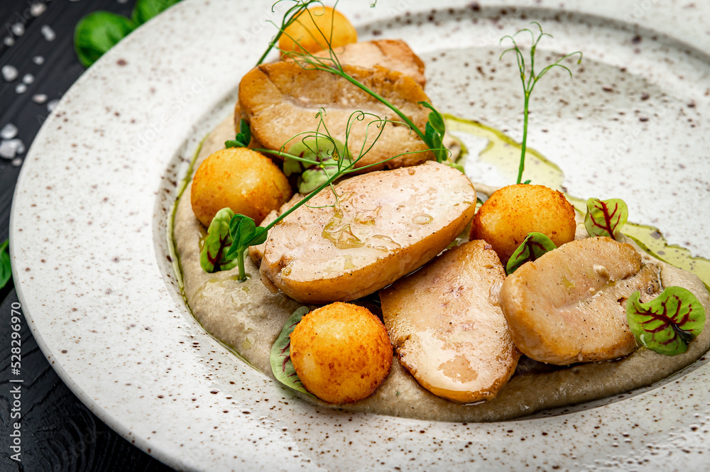 Fried bull testicles with potatoes and mushroom sauce. Stock Photo ...