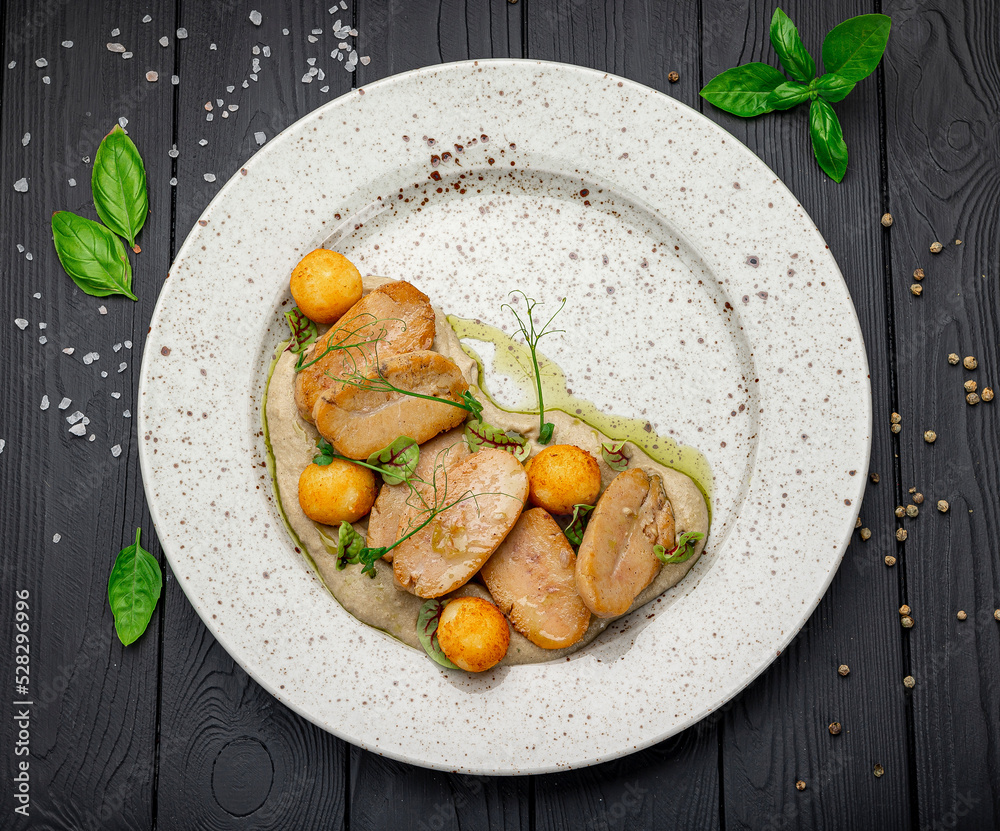 Fried bull testicles with potatoes and mushroom sauce. Stock Photo ...