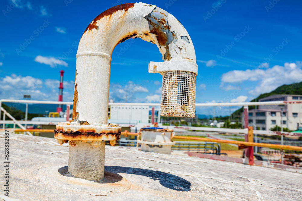 Rust damage paint and corrosion flange on the roof oil open vent tank ...