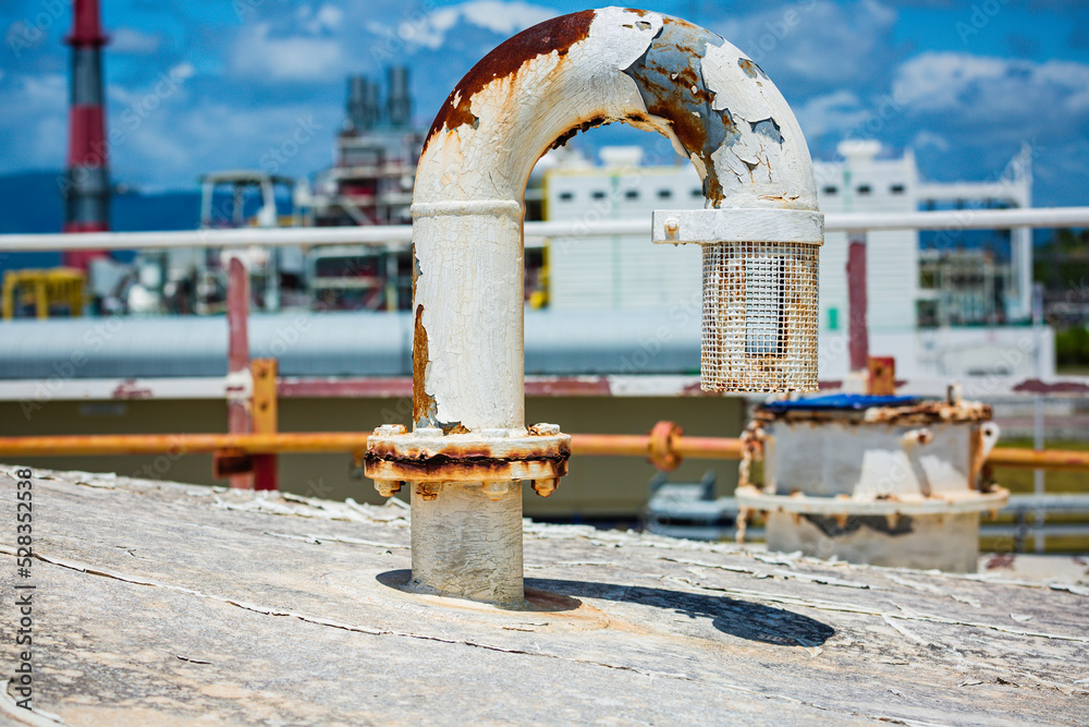 Rust damage paint and corrosion flange on the roof oil open vent tank ...