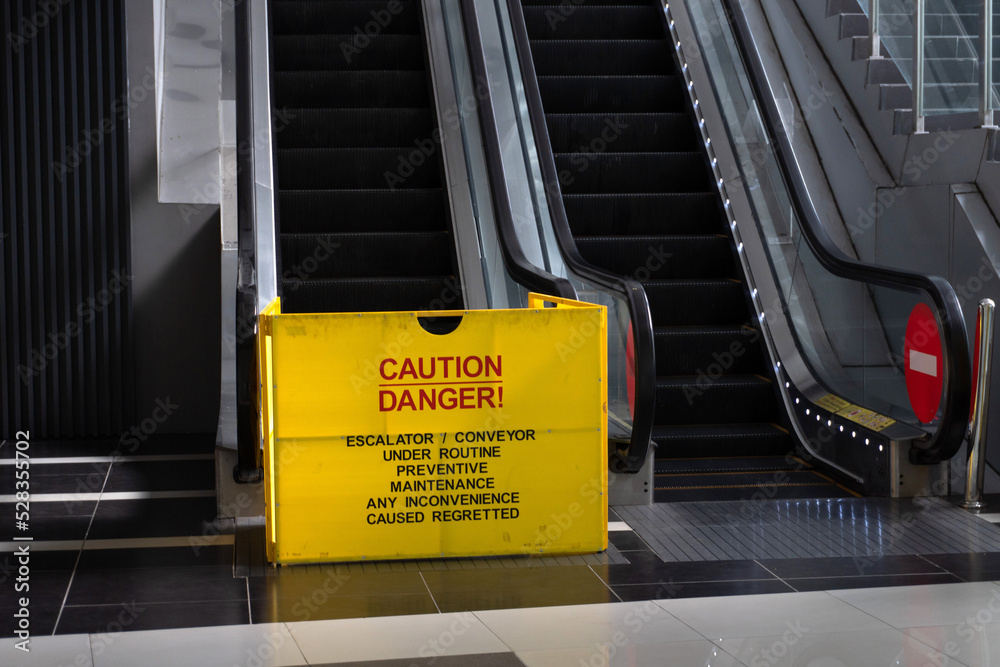 escalator broken notice inside the shopping mall Stock Photo | Adobe Stock
