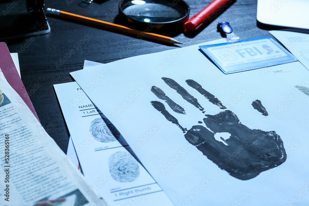 Paper sheets with different prints at workplace of FBI agent Stock ...
