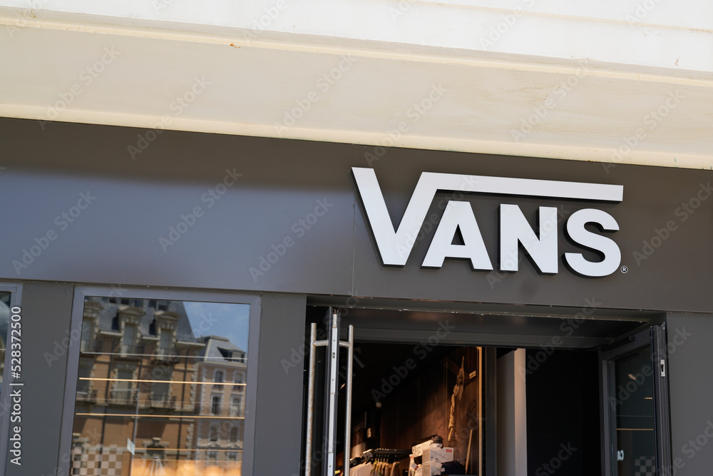 vans logo sign and brand text on store facade clothing shop entrance ...