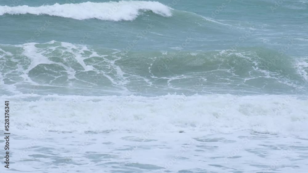 Ocean waves and sand on the beach of tropical seas in Thailand. Strong ...