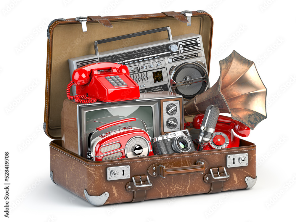 Vintage electrical and electronic appliances in an old suitcase ...