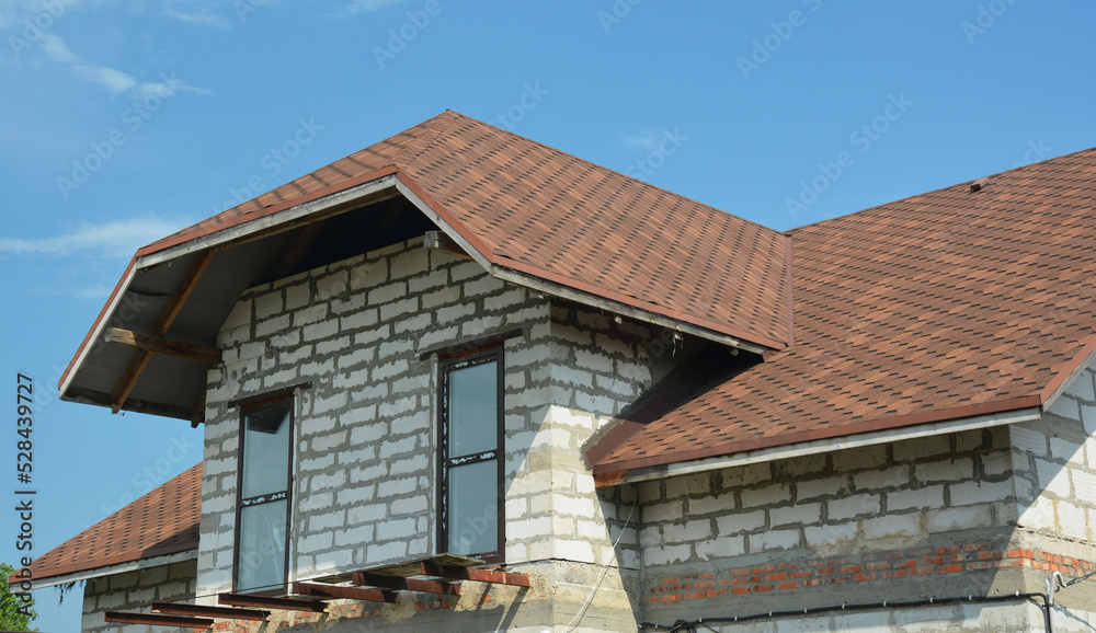 Roofing Construction with Asphalt Shingles. Close up on unfinished ...