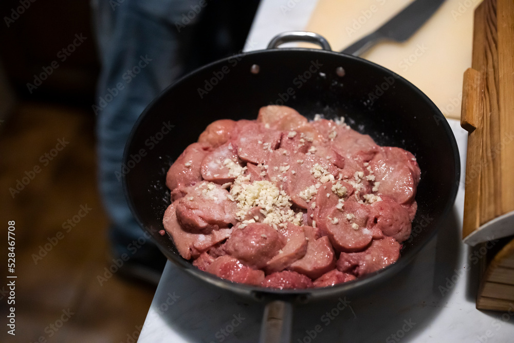 Chef Preparing Bull Balls or Testicles on a Kitchen Board Stock Photo ...