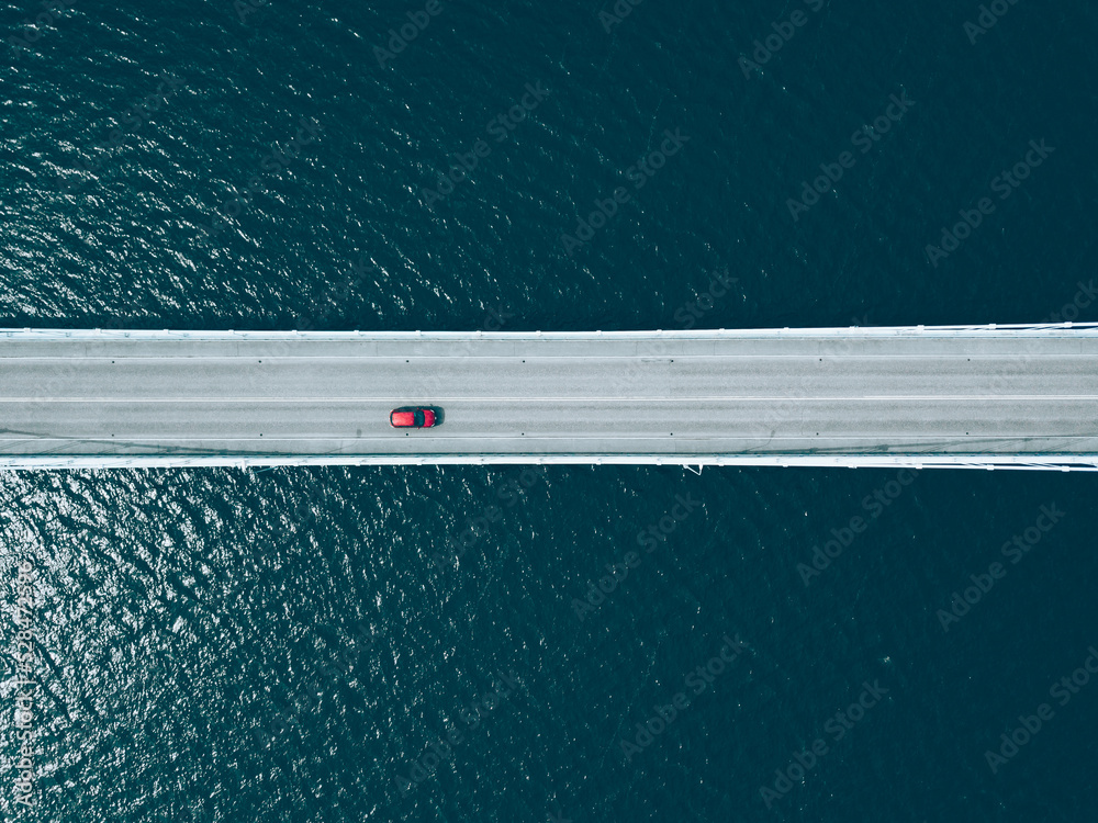 Foto de Aerial top view of bridge road with cars over blue lake do ...