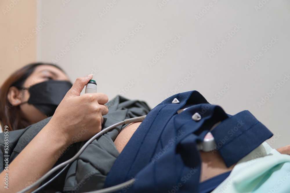 Pregnant people use Fetal Monitor on hospital for uterine contraction ...