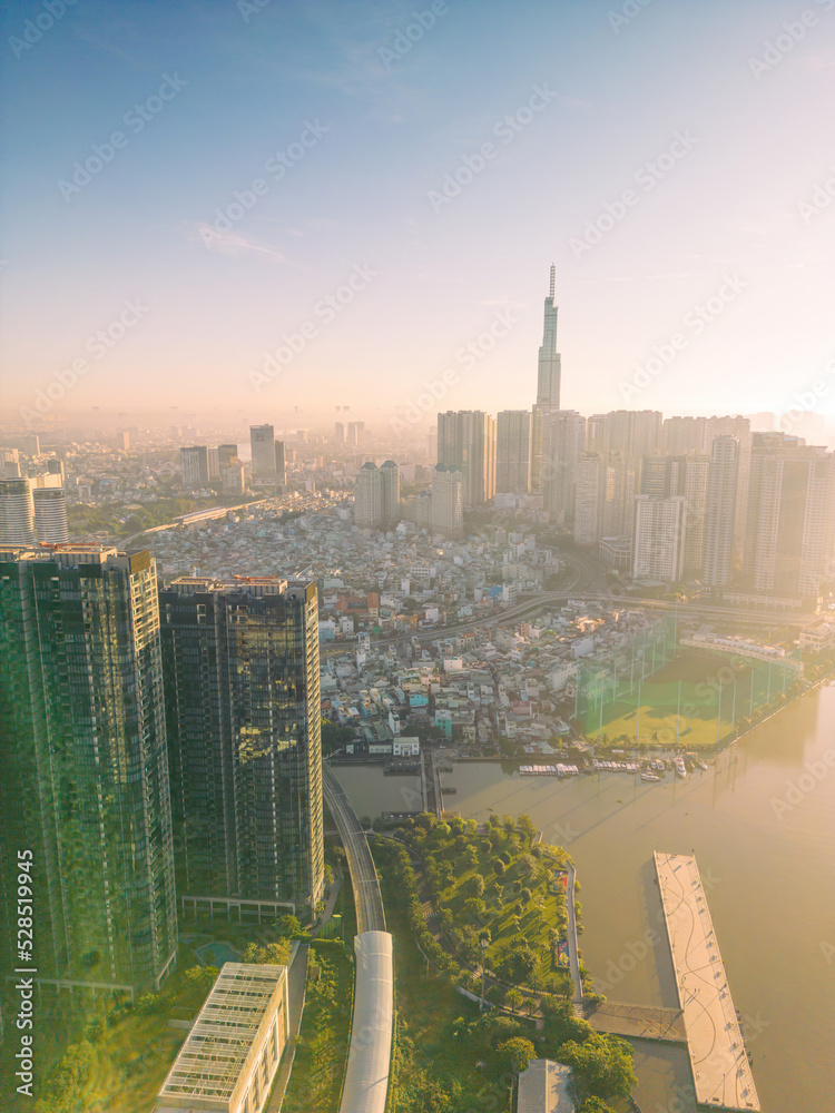 Aerial view of Ho Chi Minh City skyline and skyscrapers on Saigon river ...