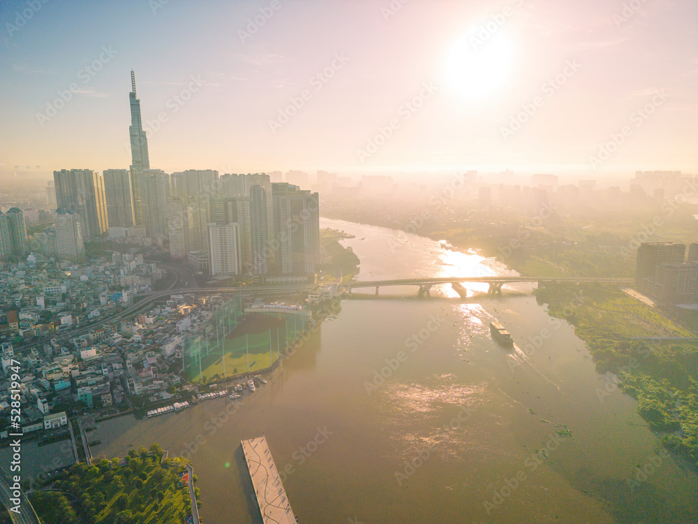 Aerial view of Ho Chi Minh City skyline and skyscrapers on Saigon river ...