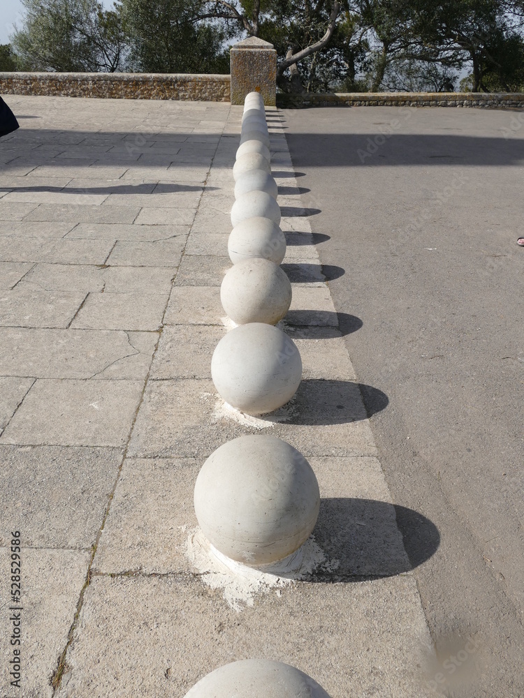 Stone balls in front of the statue of Christ on the puig (mount) San ...