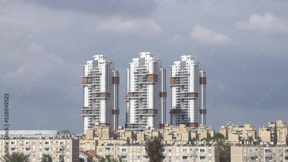 New high buildings tower over an old low-rise buildings district with ...