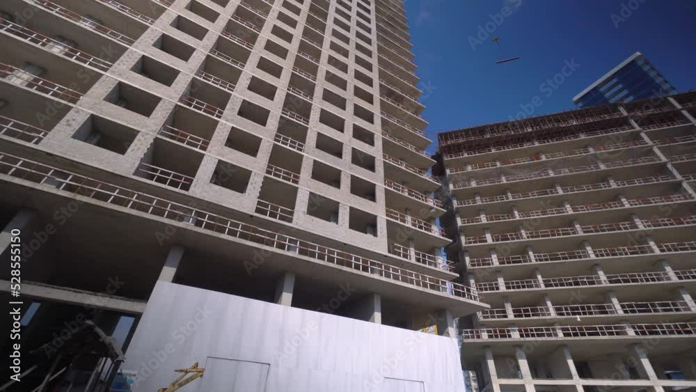 Crane and new multi-storey buildings. industrial basis. Work on ...