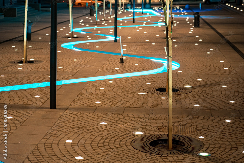 Many ground lamps are installed on the ground and illuminates at night ...