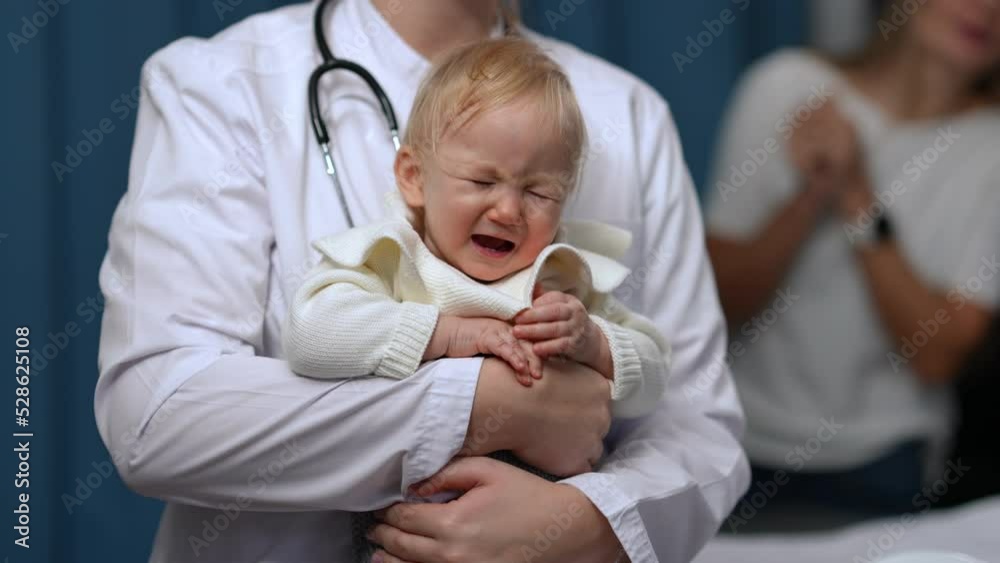 Stockvideon Portrait of dissatisfied baby crying in slow motion in ...