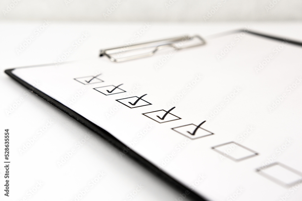 Check list with tick marks. Completed items on a white background. A ...
