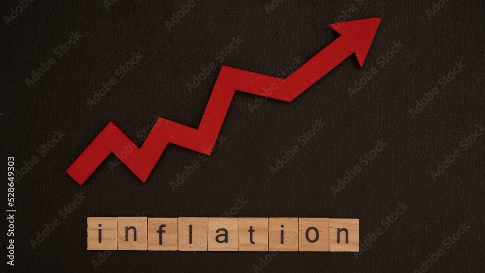 Word inflations assembled from wooden letters game and red arrow on ...