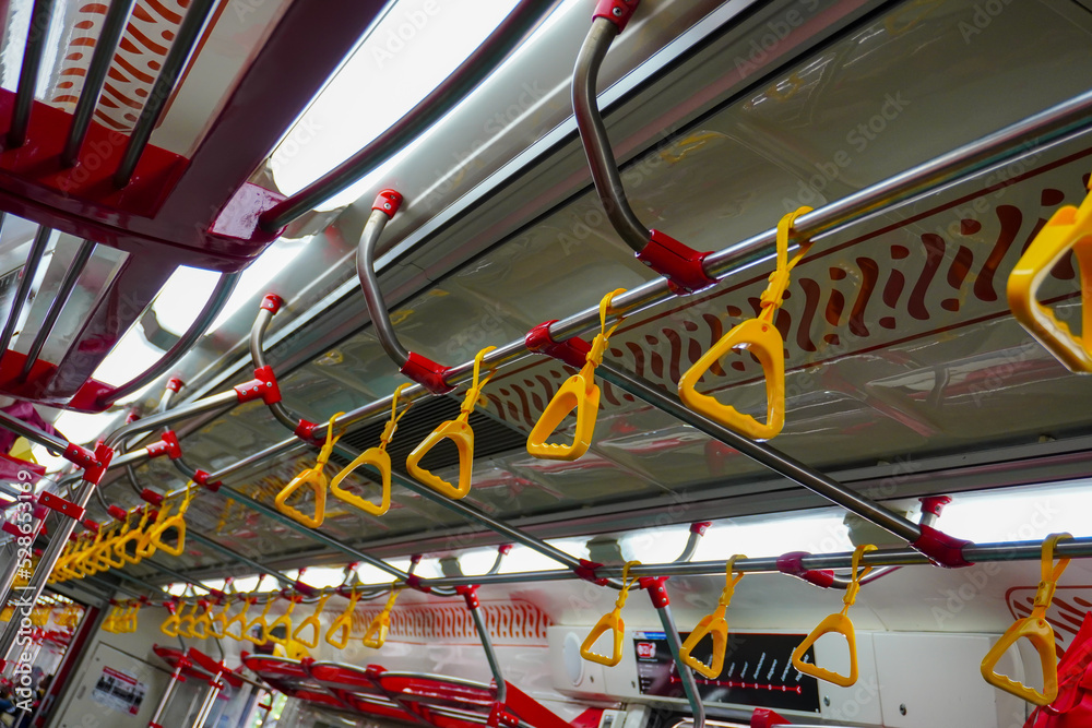 Handles for passengers. Hanging handle holders in transport. Transport ...