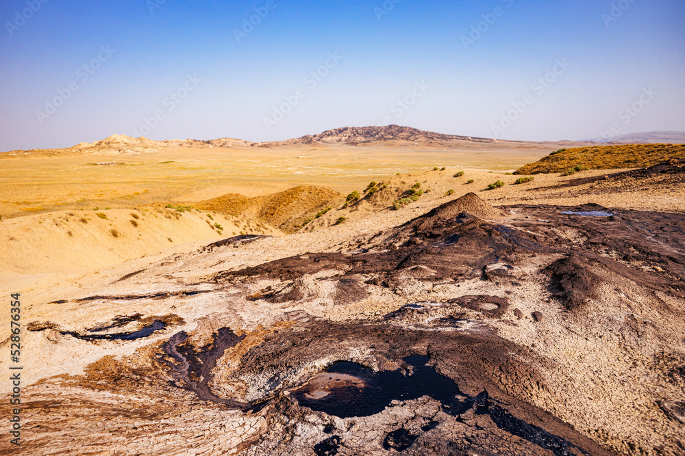 Geysers at Takhti-Tepha erupting mud and crude oil. Vashlovani desert ...
