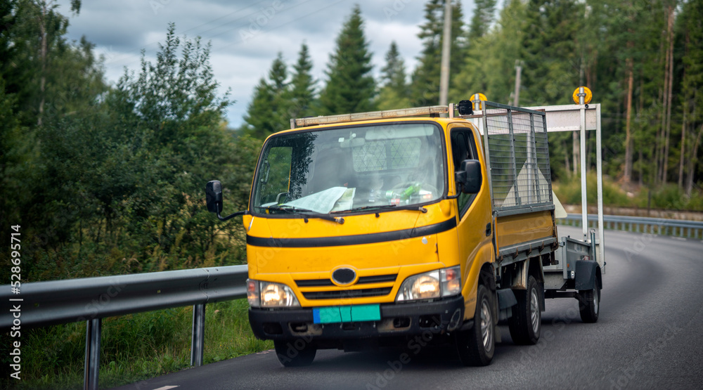 yellow contractor car on side of the road. removed logos. Stock Photo ...